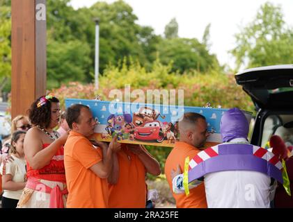 The coffin of Noah Cox-Lee, decorated with Disney cartoons is carried ...