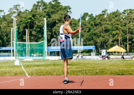 male athlete without leg with crutch javelin throw at athletics ...
