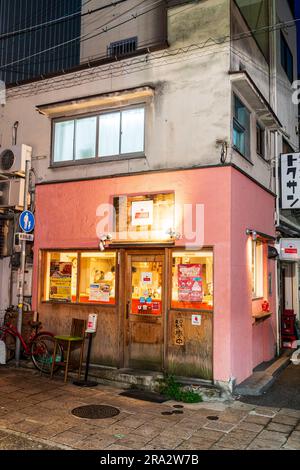 Illuminated facade of a typical small Japanese restaurant, Sone ...