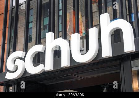 schuh. retailer for fashion footwear, shoes and trainers, sign and ...