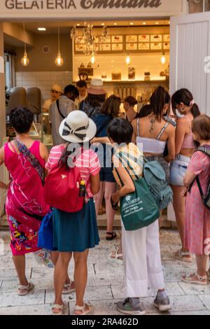 Tourists queueing for ice creams in Ironbridge, Shropshire, Uk Stock ...