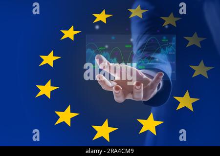 Stock exchange. Double exposure with European flag and man using ...