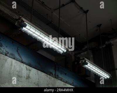 Loft industrial ceiling lights covered with wire mesh hanging under ...