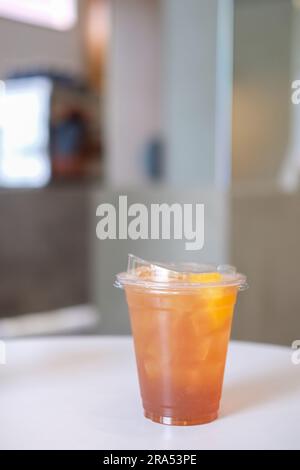 Glass with peach ice tea flavor Stock Photo - Alamy