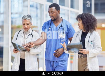 Xray, body and surgery team in hospital, consulting for cancer tumor ...