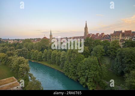 View of the Aar river at sunset as it passes through the city of Bern ...