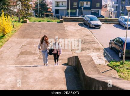 High school girls walking upstairs. Going to school concept Stock Photo ...