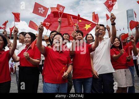 Numerous current and former government officials attend the flag rising ...