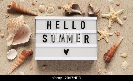 Hello Summer. Beautiful starfish and seashells on sandy beach Stock ...