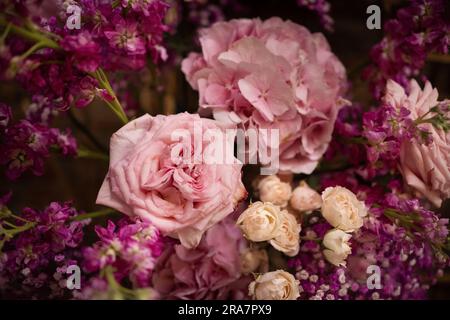 Chivalric wedding with pillars of candles and roses in glass vases ...