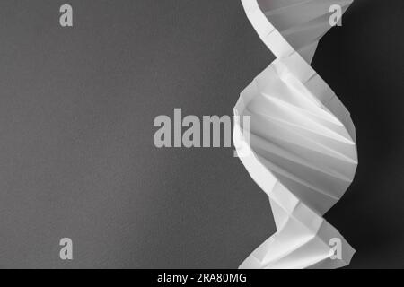 Paper model of DNA molecular chain on black background, top view Stock ...