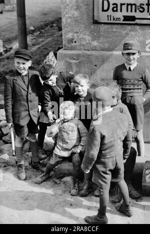 In April 1945, a five-year-old war orphan waits on a UNRRA truck at ...
