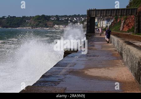 Waves crashing against the seawall at Rockstone Bridge, Dawlish, as a ...