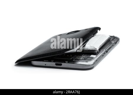 Smartphone destroyed by exploded lithium battery isolated on white ...