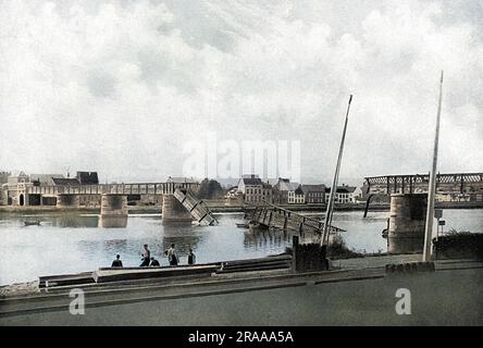 The wreck of the iron bridge across the Meuse at the Belgian town of ...