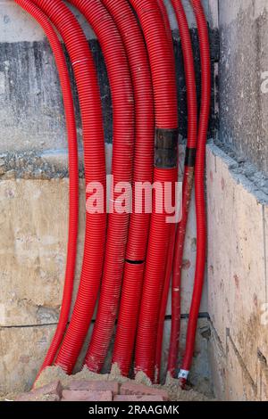 Red plumbing pipe close-up. Drainage, tubing, pipes. Red pipes of the ...