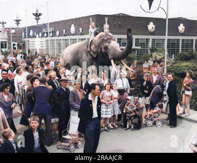 A crowd of holidaymakers at Butlin's holiday camp, Filey, pose with an ...