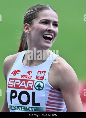 Pia Skrzyszowska, of Poland, wins her Women's 100 meters hurdles ...