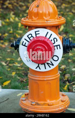 Orange fire hydrant Stock Photo - Alamy