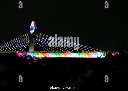 Cable bridge in hyderabad decorated with colorful LEDs showing cloors ...