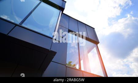 Graphite facade and large windows on a fragment of an office building ...