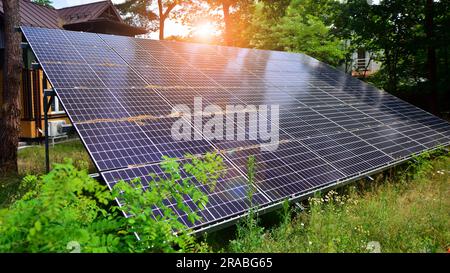 Photovoltaic panels standing on a paved surface against the background ...