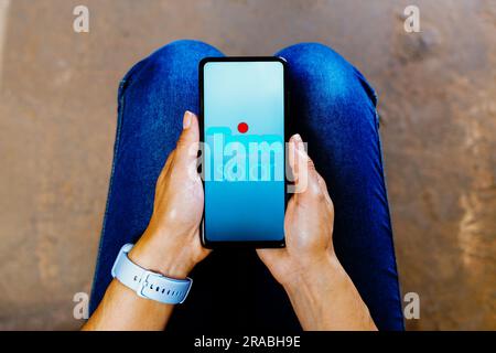 In this photo illustration, the Trina Solar logo is displayed on a ...