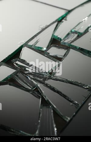 Shards of broken mirror on backing board, closeup Stock Photo - Alamy