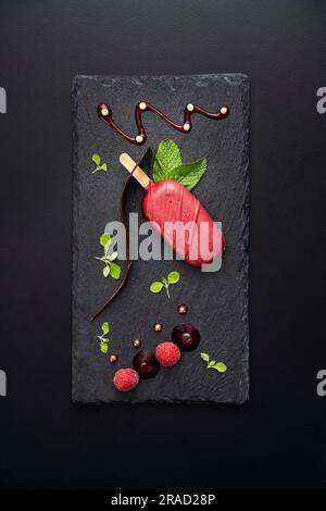Raspberry ice cream on a stick Stock Photo - Alamy