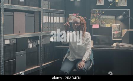 African american policeman working with hologram, planning ...