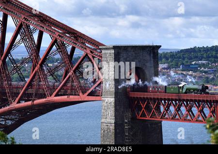 The Flying Scotsman passes over the Forth Bridge near Edinburgh in ...