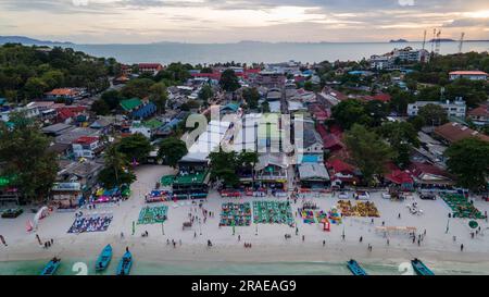 People attend the Full Moon Party on Hat Rin beach on Koh Phangan ...