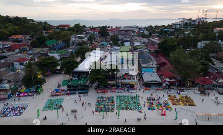 People attend the Full Moon Party on Hat Rin beach on Koh Phangan ...