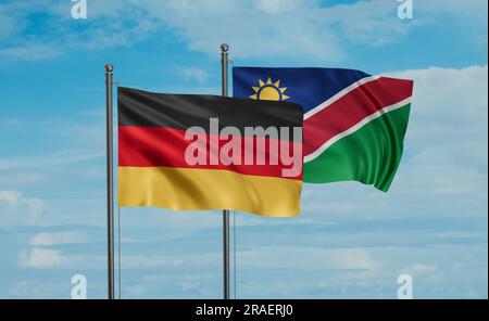 Namibia and Germany flag waving together in the wind on blue sky, two ...