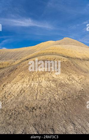 Colorful Mancos Shale formations with eroded sandstone boulders in the ...