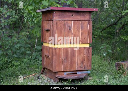 Colorful homemade bee hives - old construction Stock Photo - Alamy
