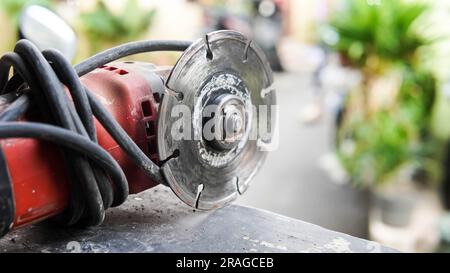 worker cutting ceiling with angle grinder in construction site Stock ...