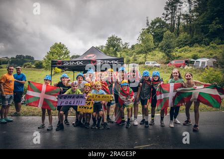 Group of Basque fan children with the flags in a stage of the Tour de ...