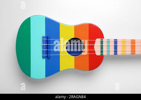 Colorful ukulele on white background, top view. String musical ...