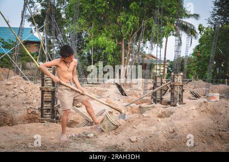 Poor children at the construction site were forced to work. Concept ...