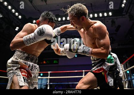 Jukiya Iimura (black gloves) hits Josuke Nagata (white gloves) in the ...