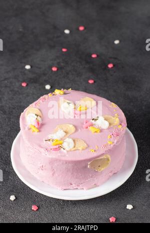 Box with tasty bento cake, gifts and hearts isolated on white ...