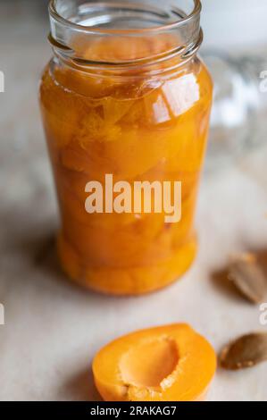 Preserved fruits in a jar. Fresh stewed apricots Stock Photo - Alamy