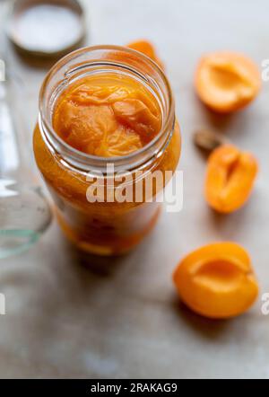 Preserved fruits in a jar. Fresh stewed apricots Stock Photo - Alamy