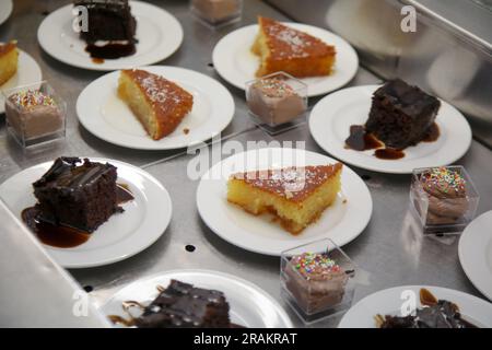 Various desserts served in a buffet line Stock Photo - Alamy