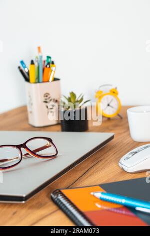 the closed notebook computer was placed on the desk in the office ...