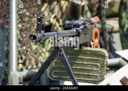 Soviet-made PK machine gun and camouflage netting.. "Kalashnikov's ...