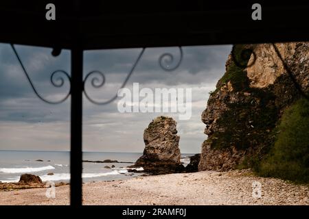 Marsden Rock in Marsden Bay viewed through the gazebo of Marsden Grotto ...