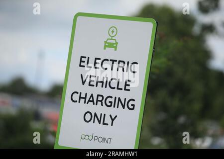 Electric vehicle charging only sign in a public car park Stock Photo ...