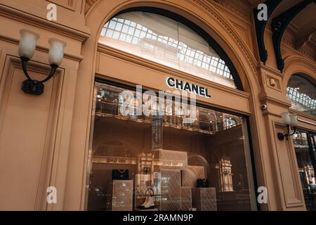 Classy aesthetic Chanel boutique entrance. Neutral beige stand with ...